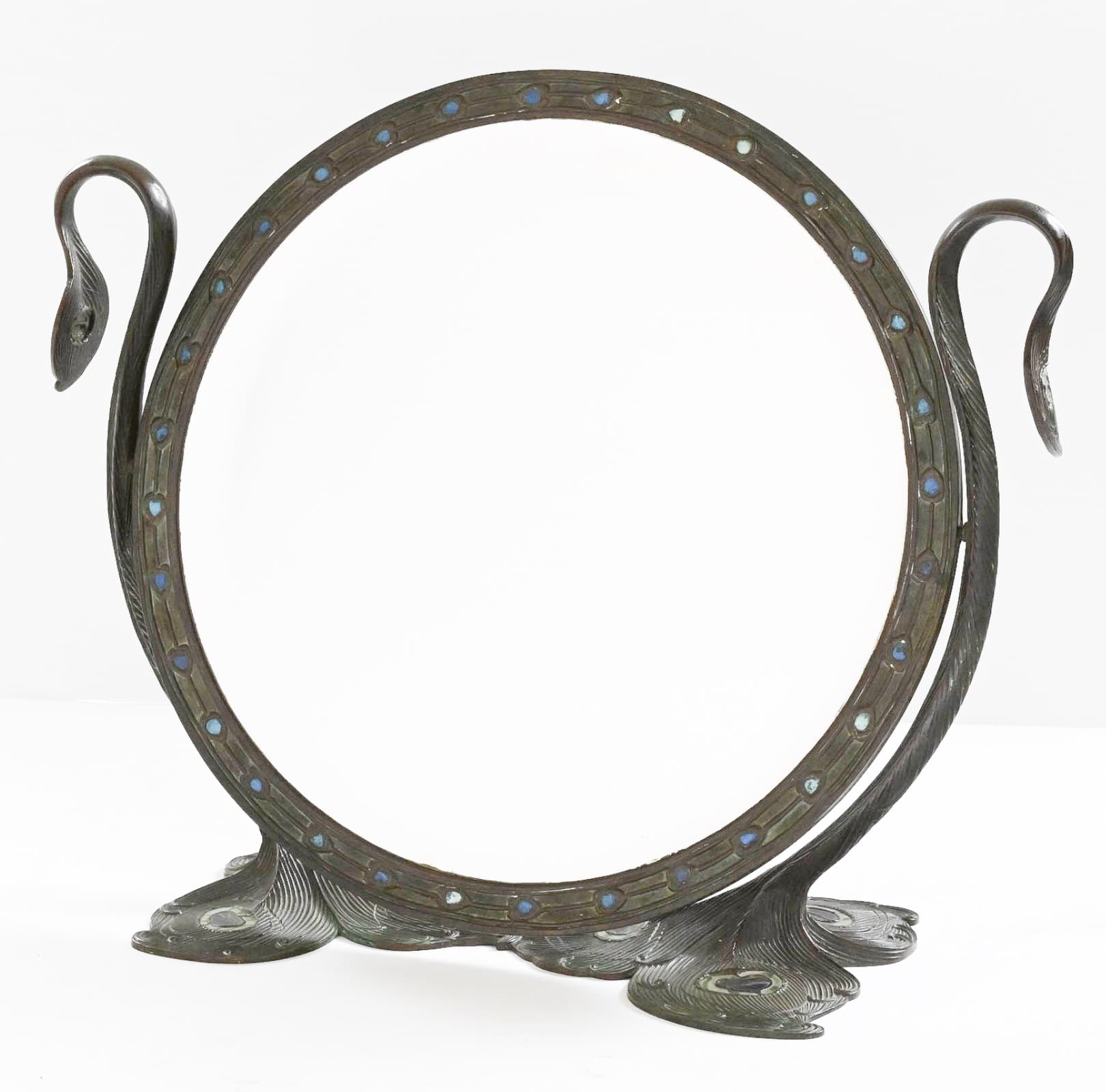 A Tiffany Studios New York glass and bronze Peacock mirror